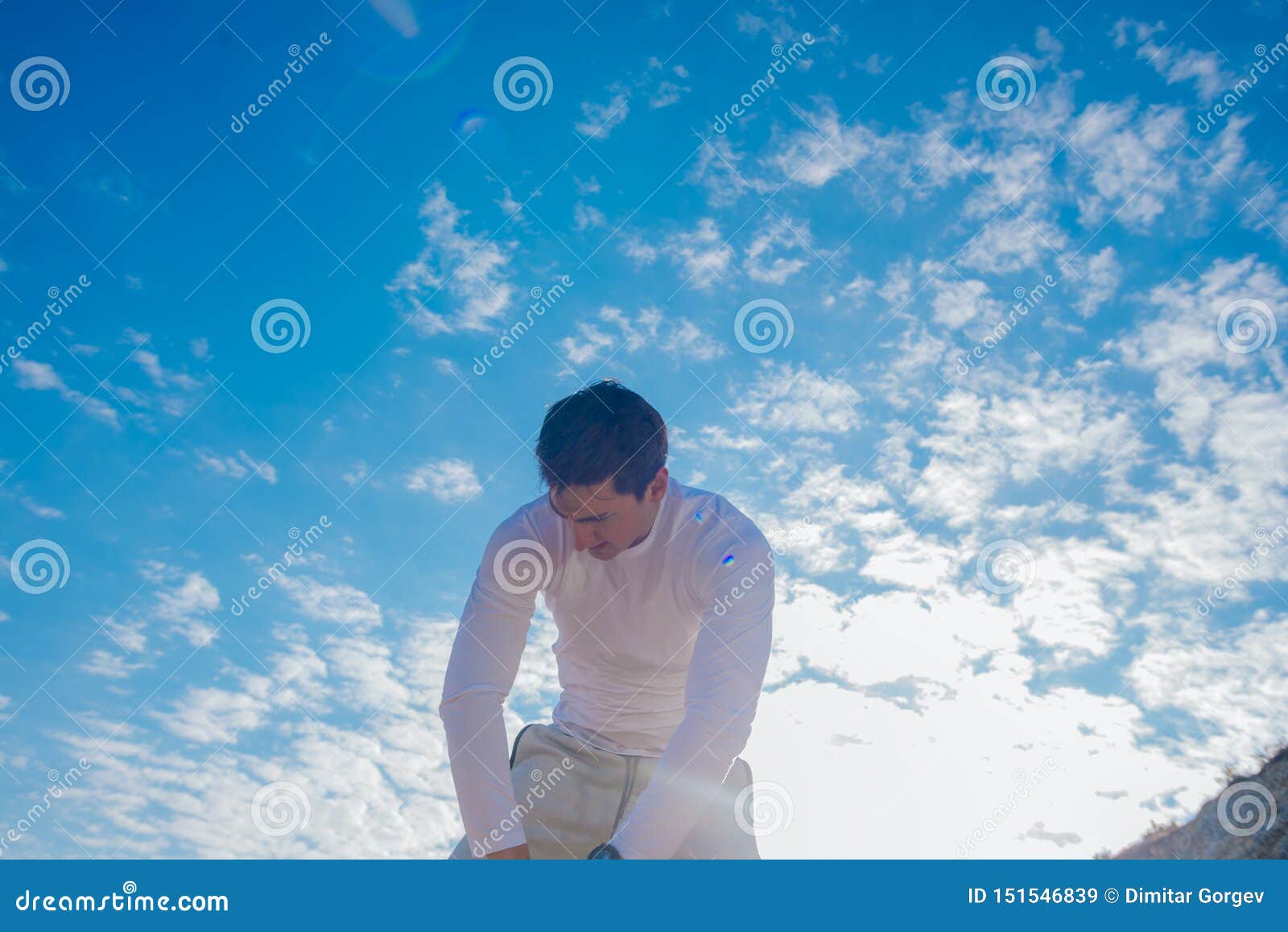 Bodybuilder Performing His Stretching Routine in the Morning on an ...
