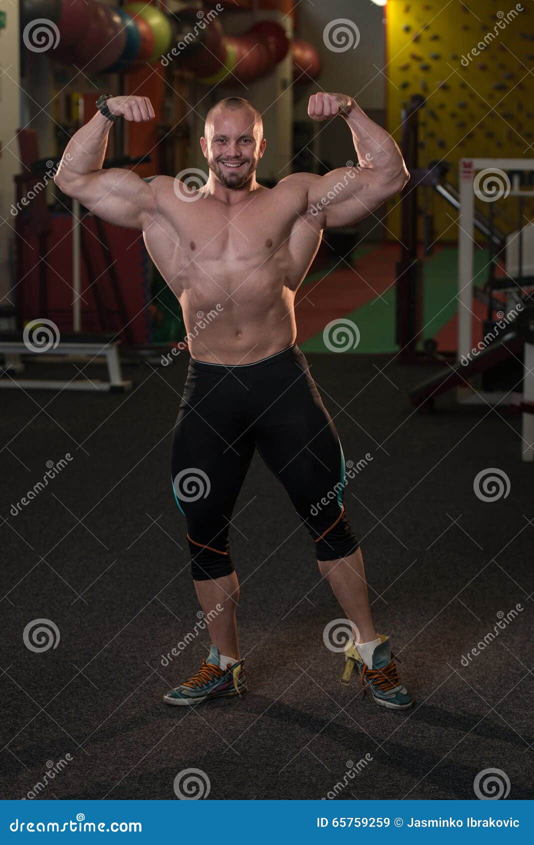 Bodybuilder Performing Rear Double Biceps Pose Stock Image - Image of ...