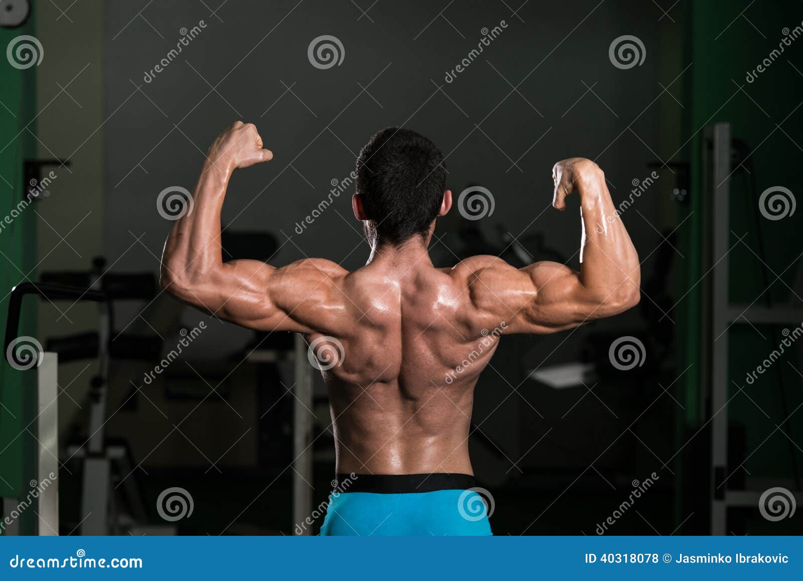 Bodybuilder Performing Rear Double Biceps Poses Stock Photo - Image of ...