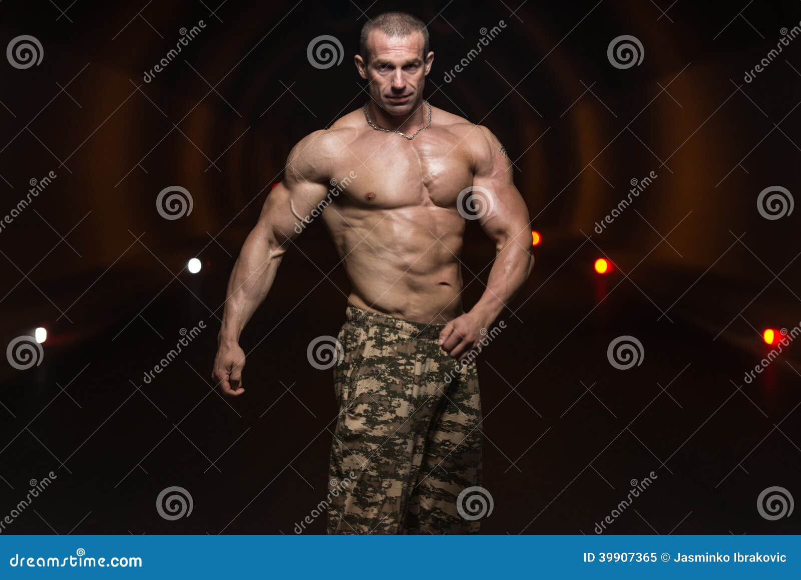 Bodybuilder Performing Side Chest Poses in Tunnel Stock Image - Image ...