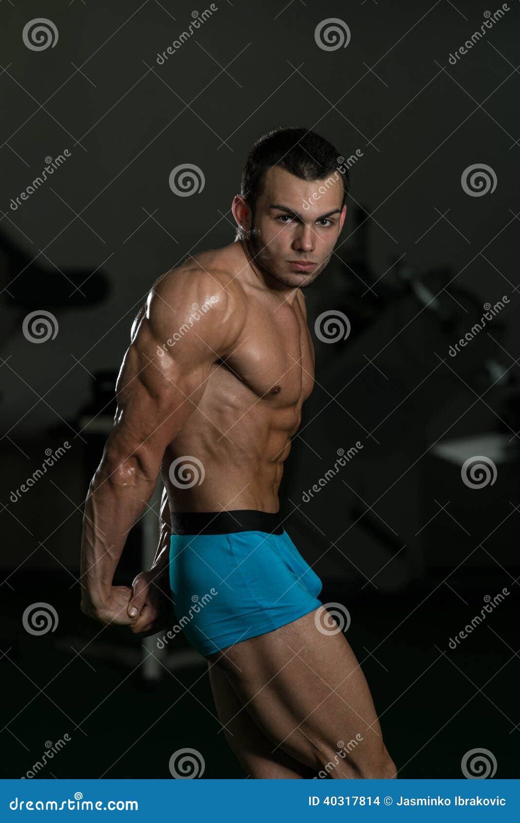 Bodybuilder Performing Side Triceps Poses Stock Photo - Image of body ...