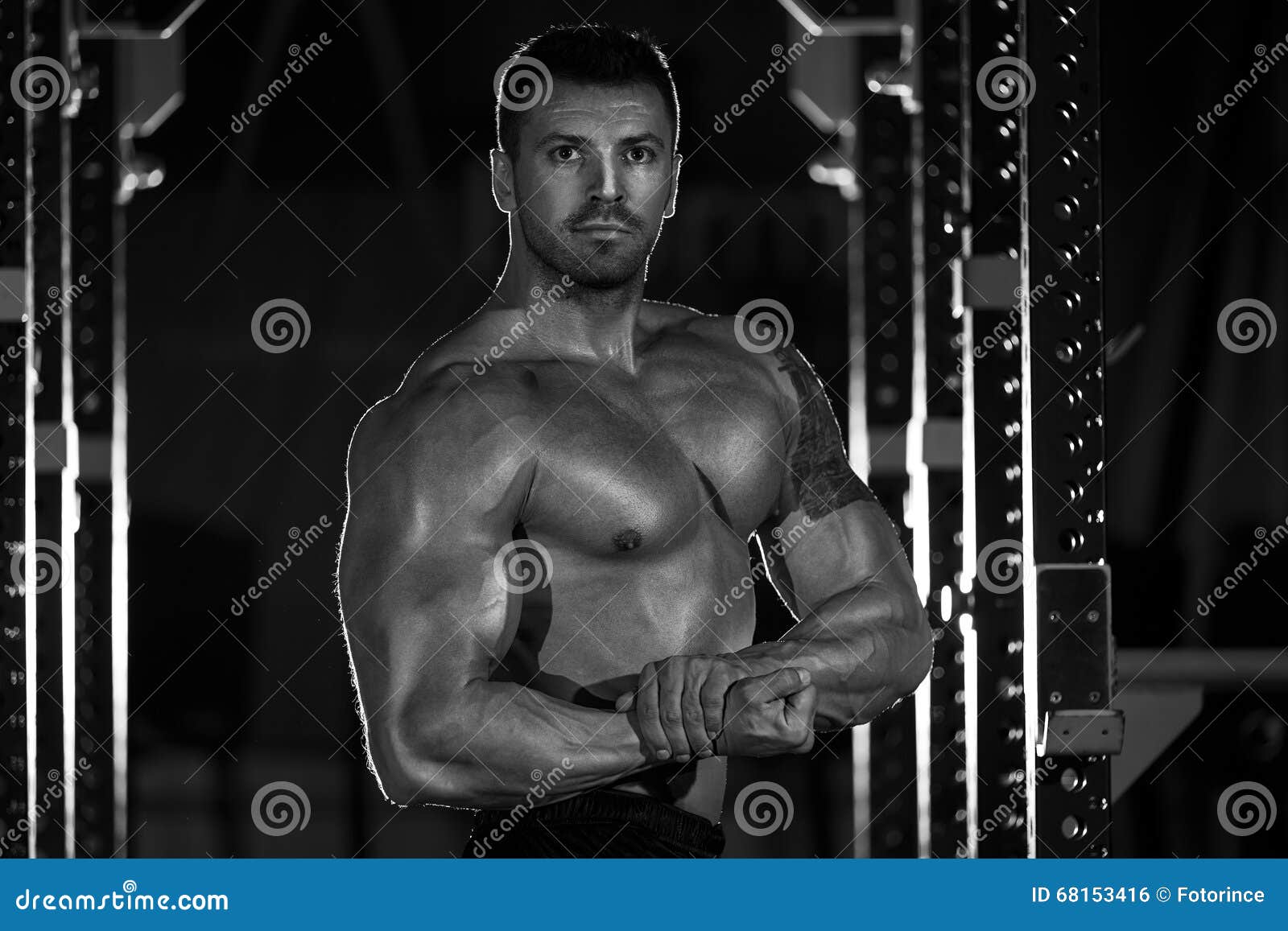 Bodybuilder posing stock photo. Image of handsome, form - 68153416