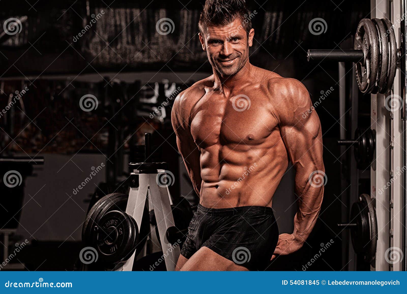Bodybuilder Man Posing With A Sword Isolated On White Background ...