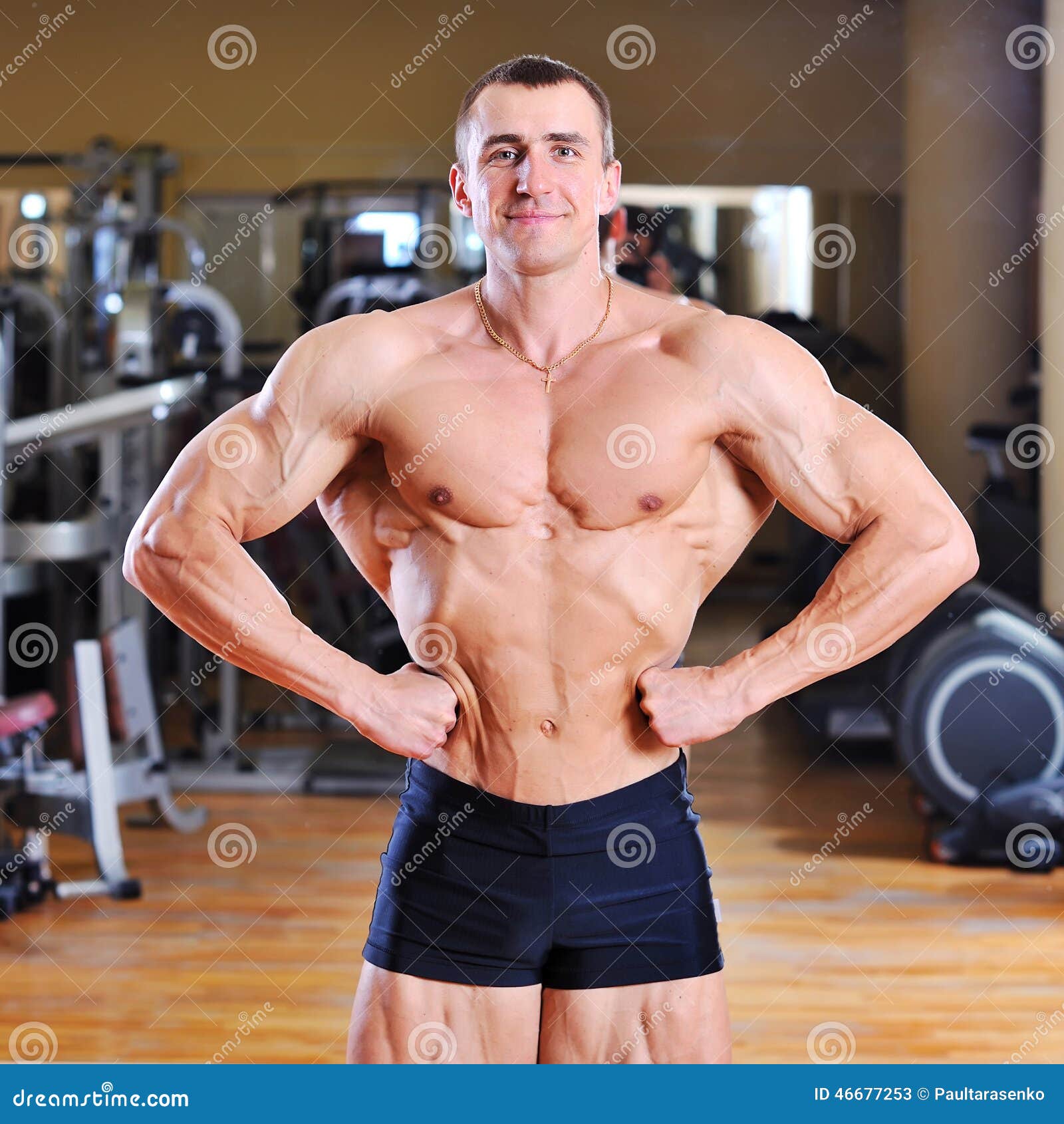 Bodybuilder posing in gym stock image. Image of bodybuilding - 46677253