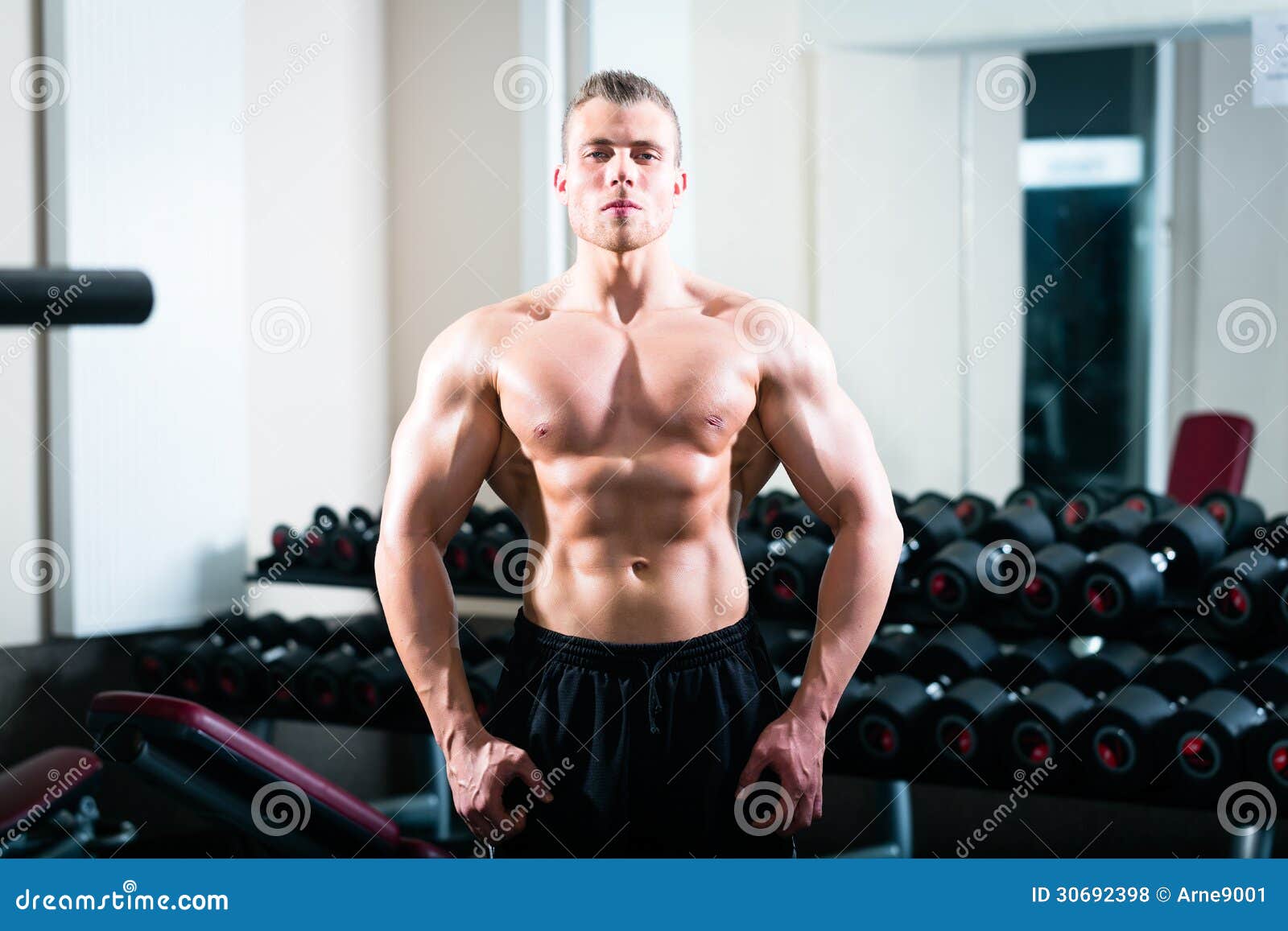 Bodybuilder posing in Gym stock photo. Image of pose - 30692398