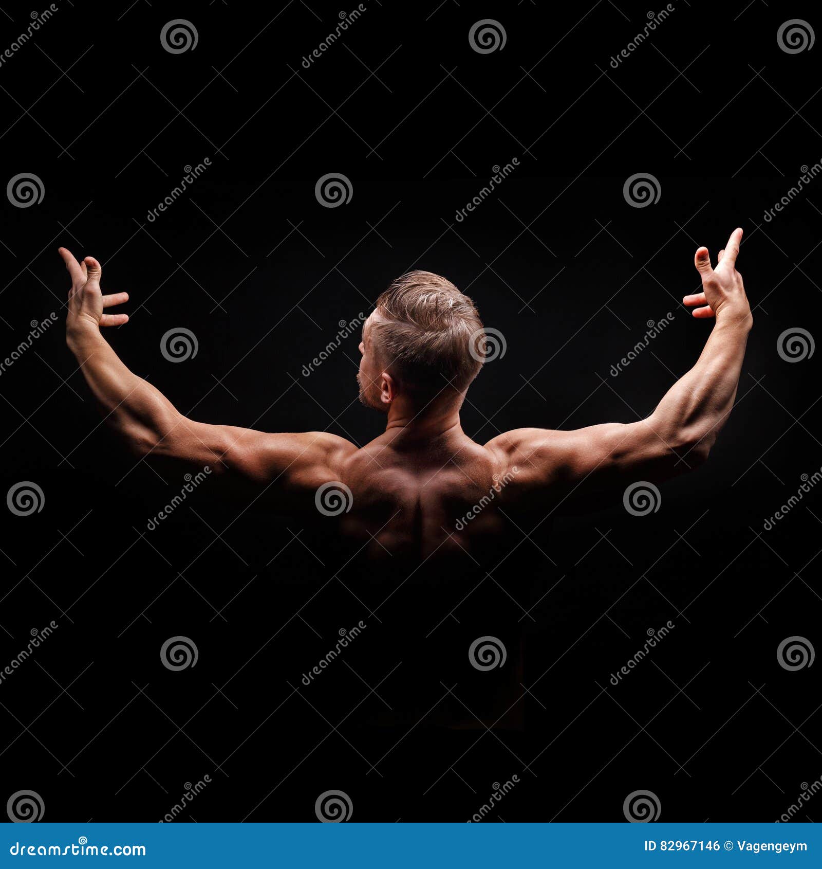 Bodybuilder Posing. Muscles the Shoulders. Stock Photo - Image of ...