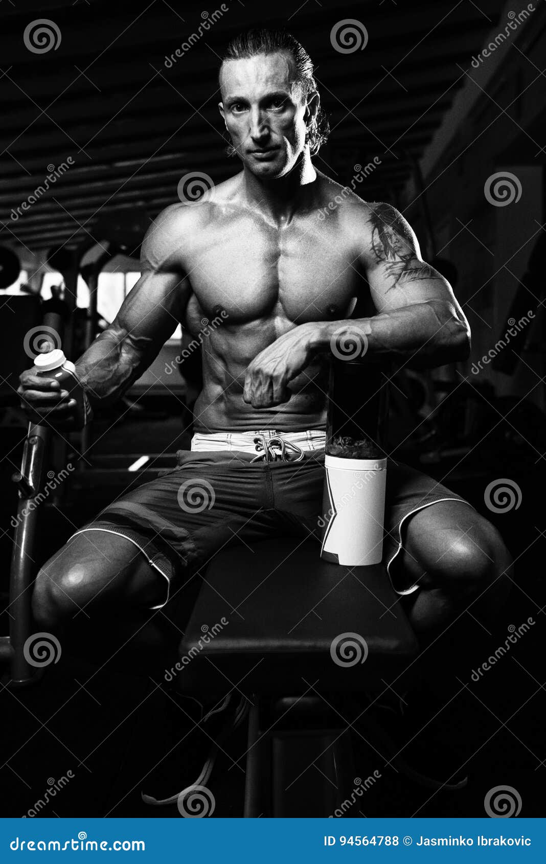 Bodybuilder Posing with Supplements for Copy Space Stock Photo - Image ...