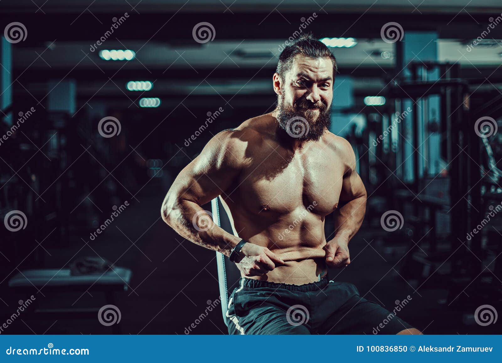 Bodybuilder pulling skin stock photo. Image of active - 100836850