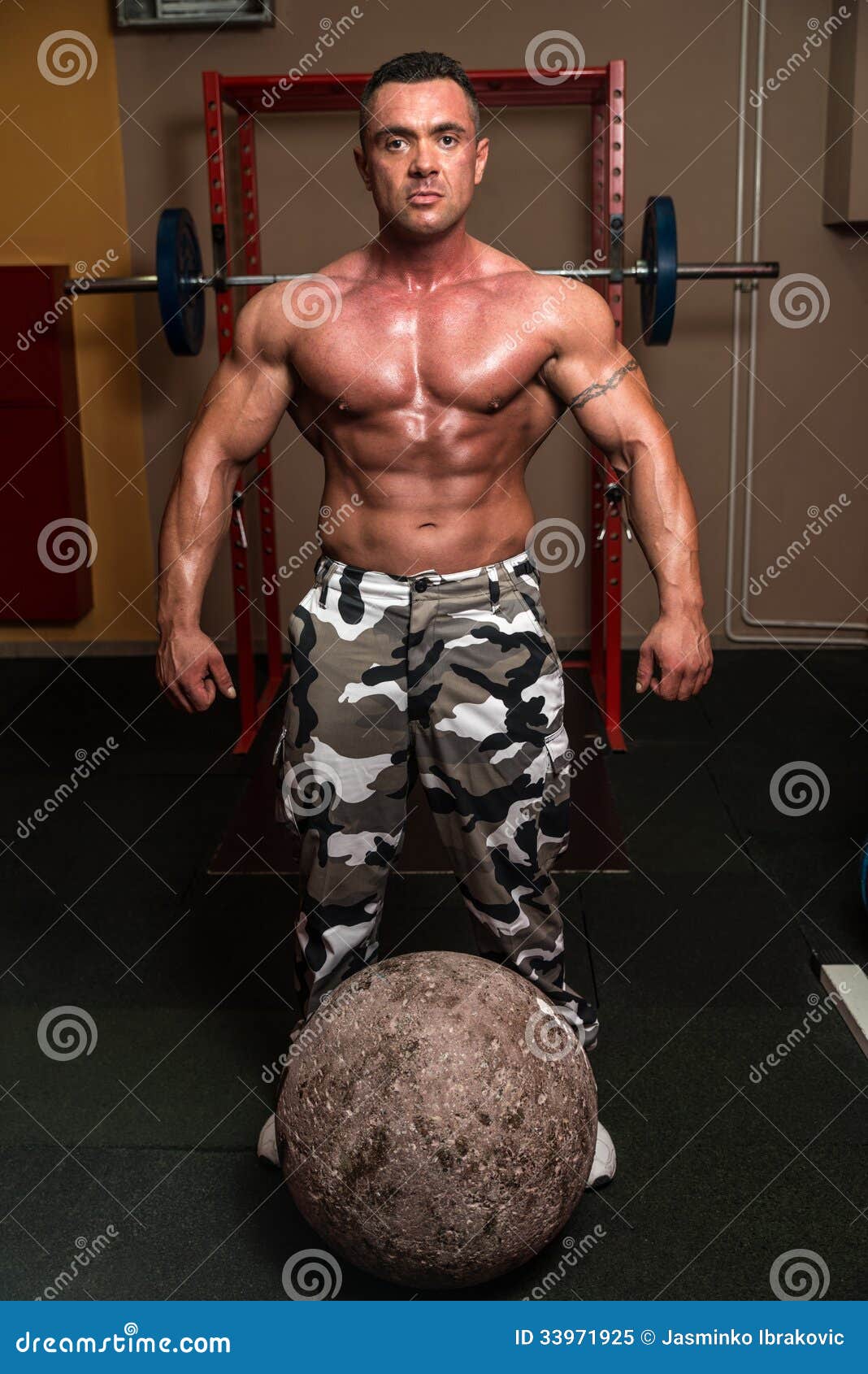 Bodybuilder Resting after Picking Up a Stone Stock Image - Image of ...