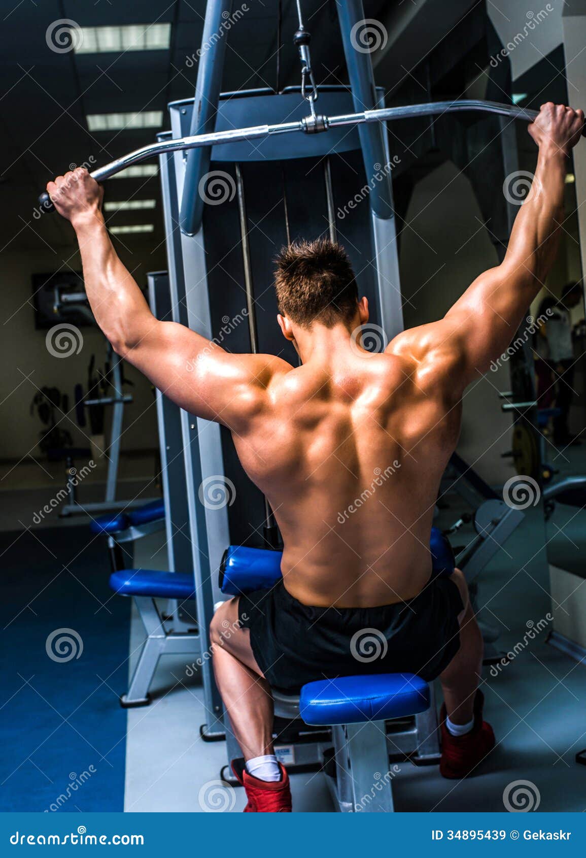 Bodybuilder with simulator stock image. Image of male - 34895439