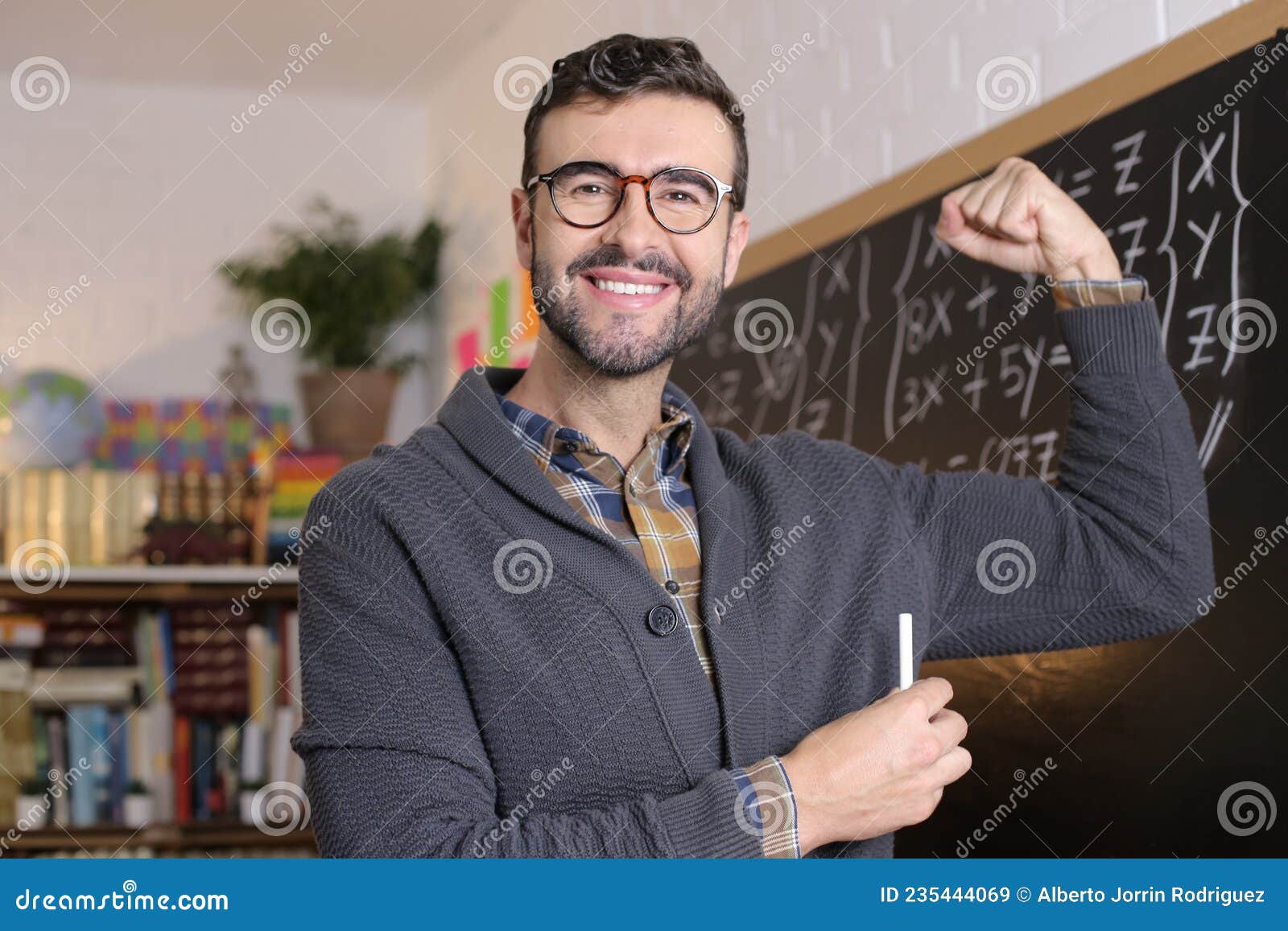 Bodybuilder Teacher Flexing Bicep in Classroom Stock Image - Image of ...