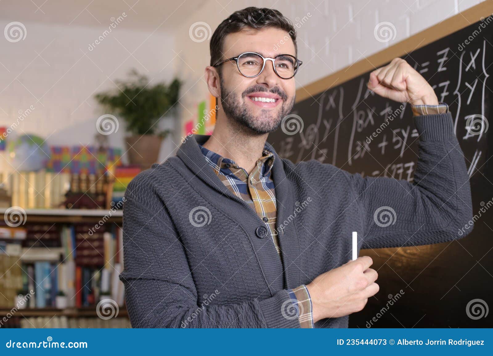 Bodybuilder Teacher Flexing Bicep in Classroom Stock Image - Image of ...