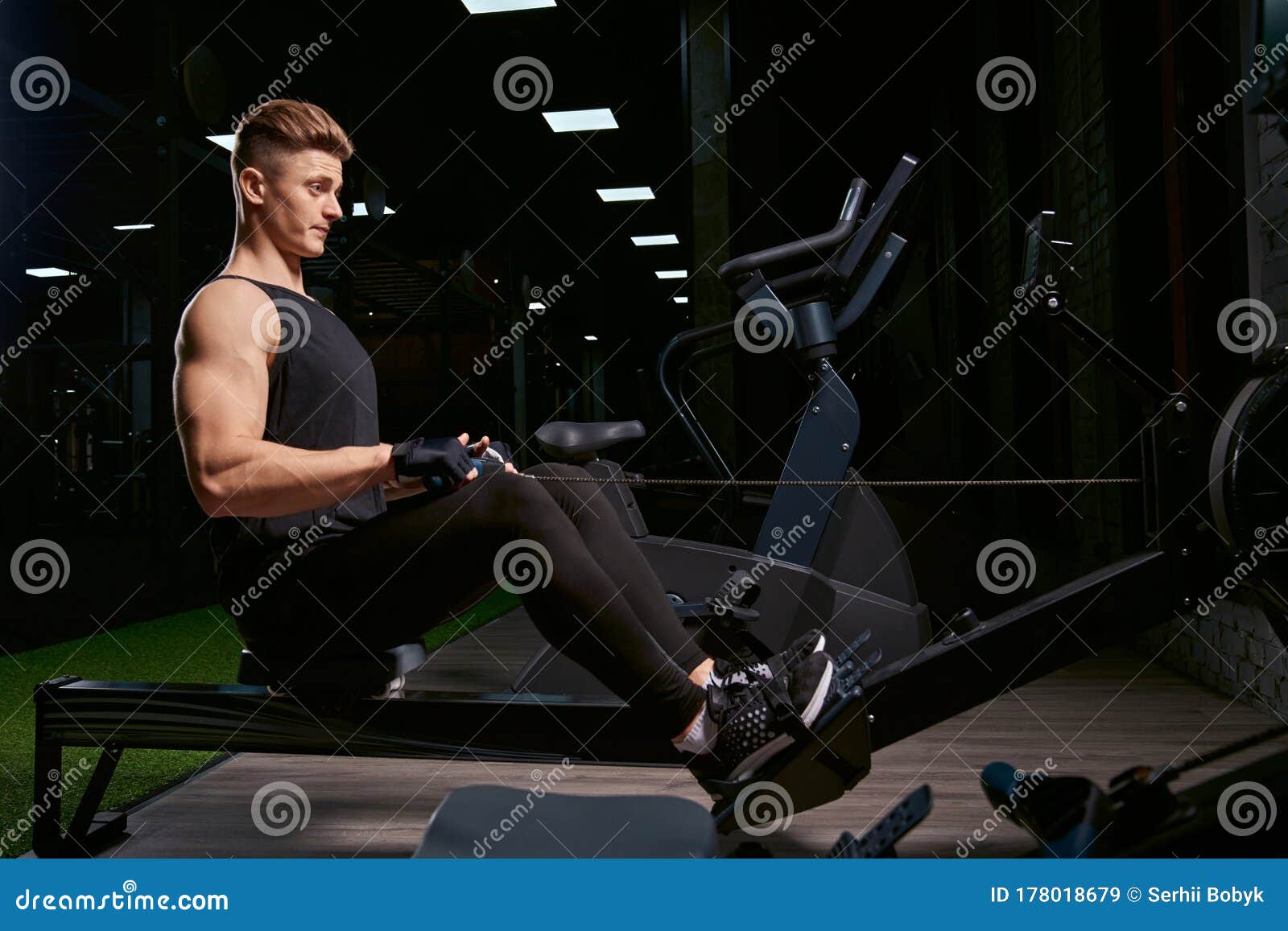 Bodybuilder Training Back on Exercise Machine. Stock Image - Image of ...