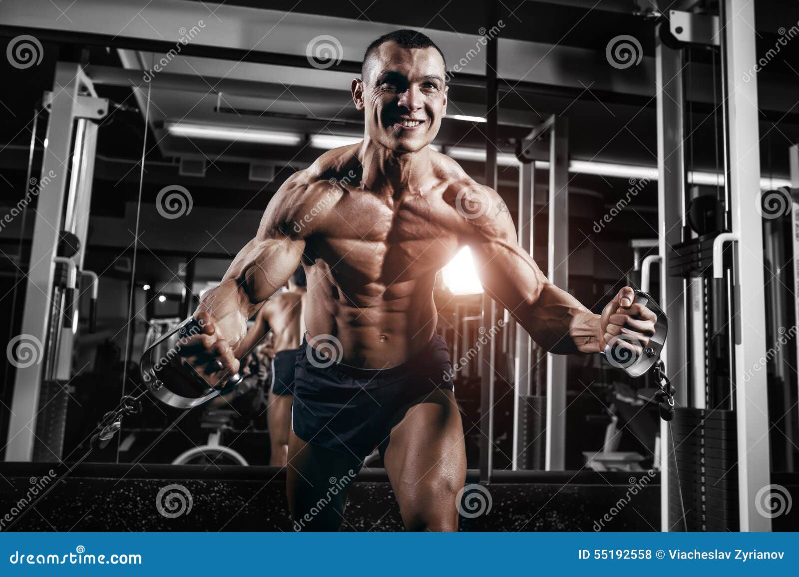 Bodybuilder Training Chest on Simulator in the Gym Stock Photo - Image ...