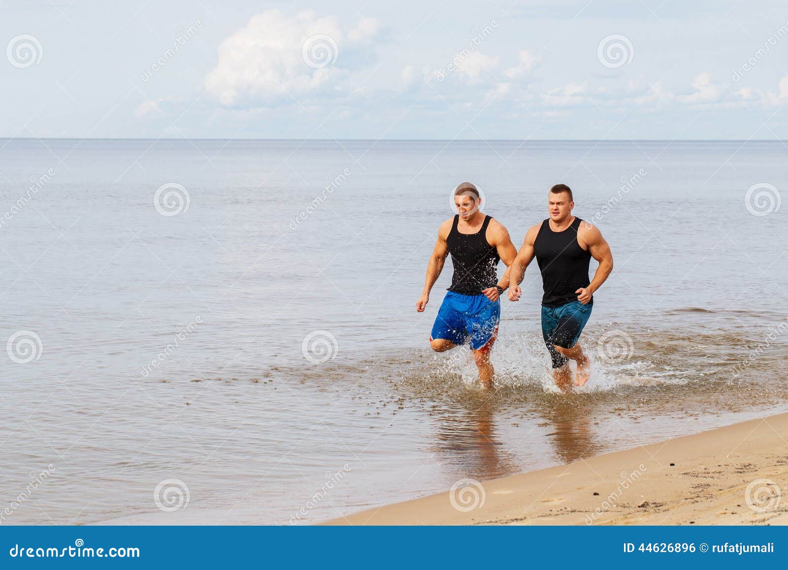Bodybuilders on the beach stock photo. Image of homosexual - 44626896