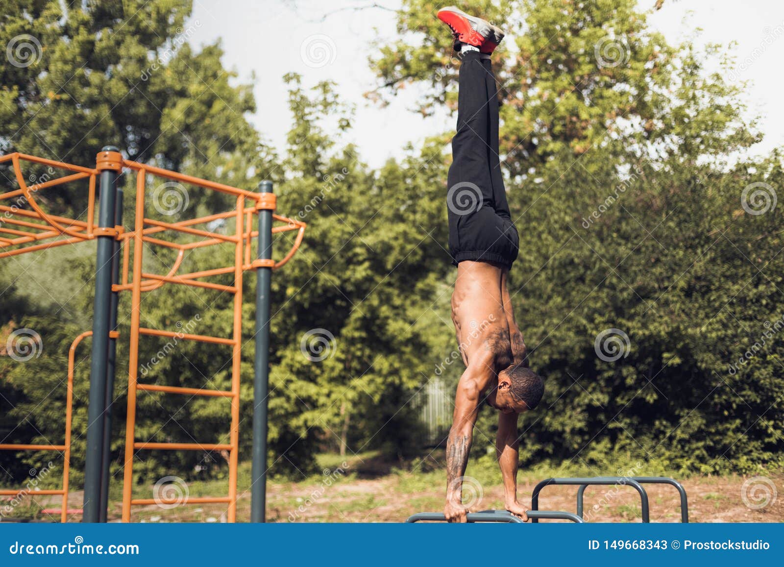 Bodyweight Exercise. Man Standing on Hands and Doing Push Ups Stock ...