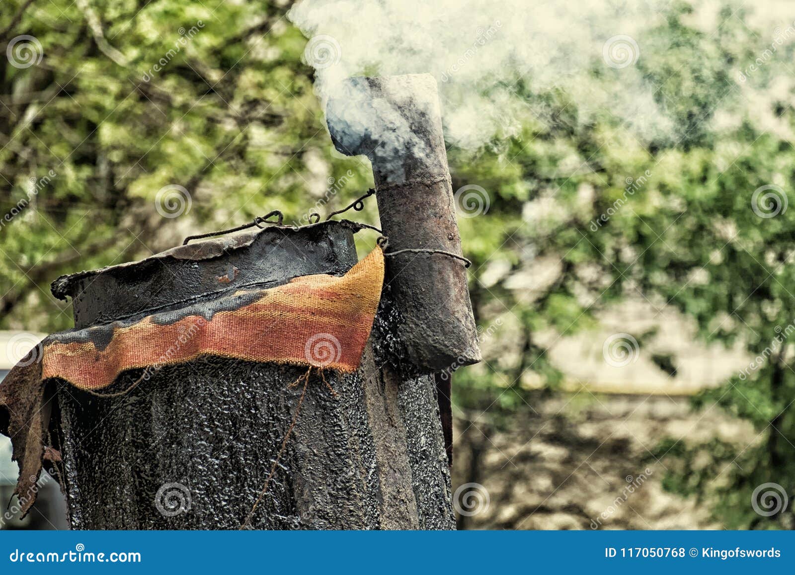 Boiling Hot Asphalt Is Filled Into A Bucket From An Asphalt Machine To ...