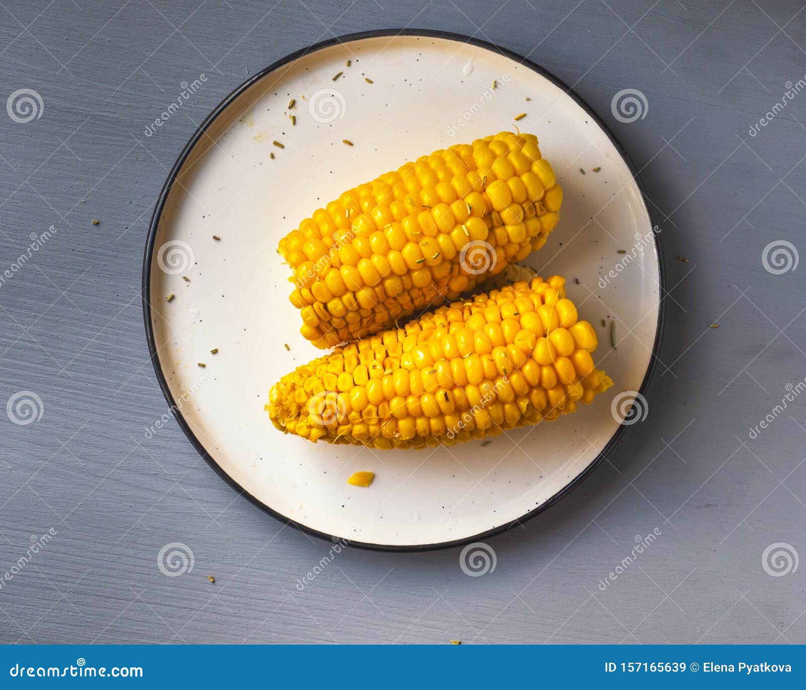 Boiled Corn on a Ceramic Plate, Two Halves, Shot at Close Range Stock ...
