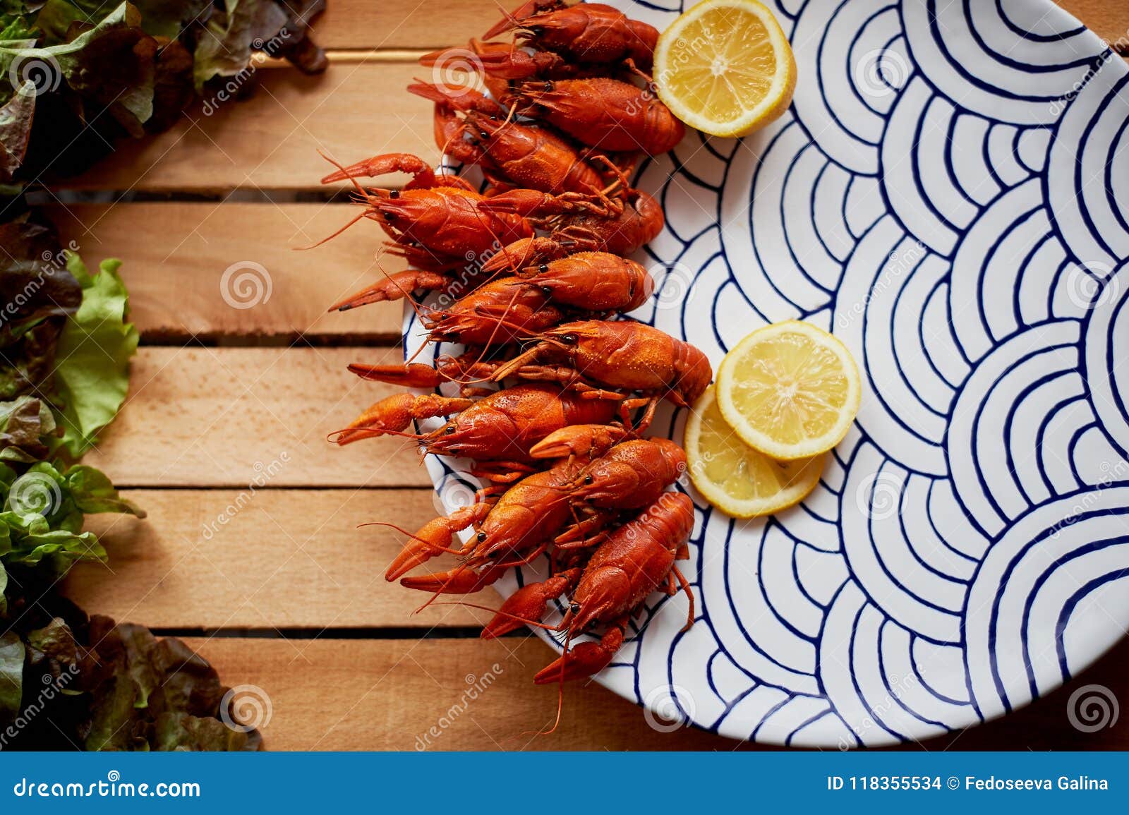 Boiled Crawfish are on the Dish with Interesting Ornament. Fresh Salad ...