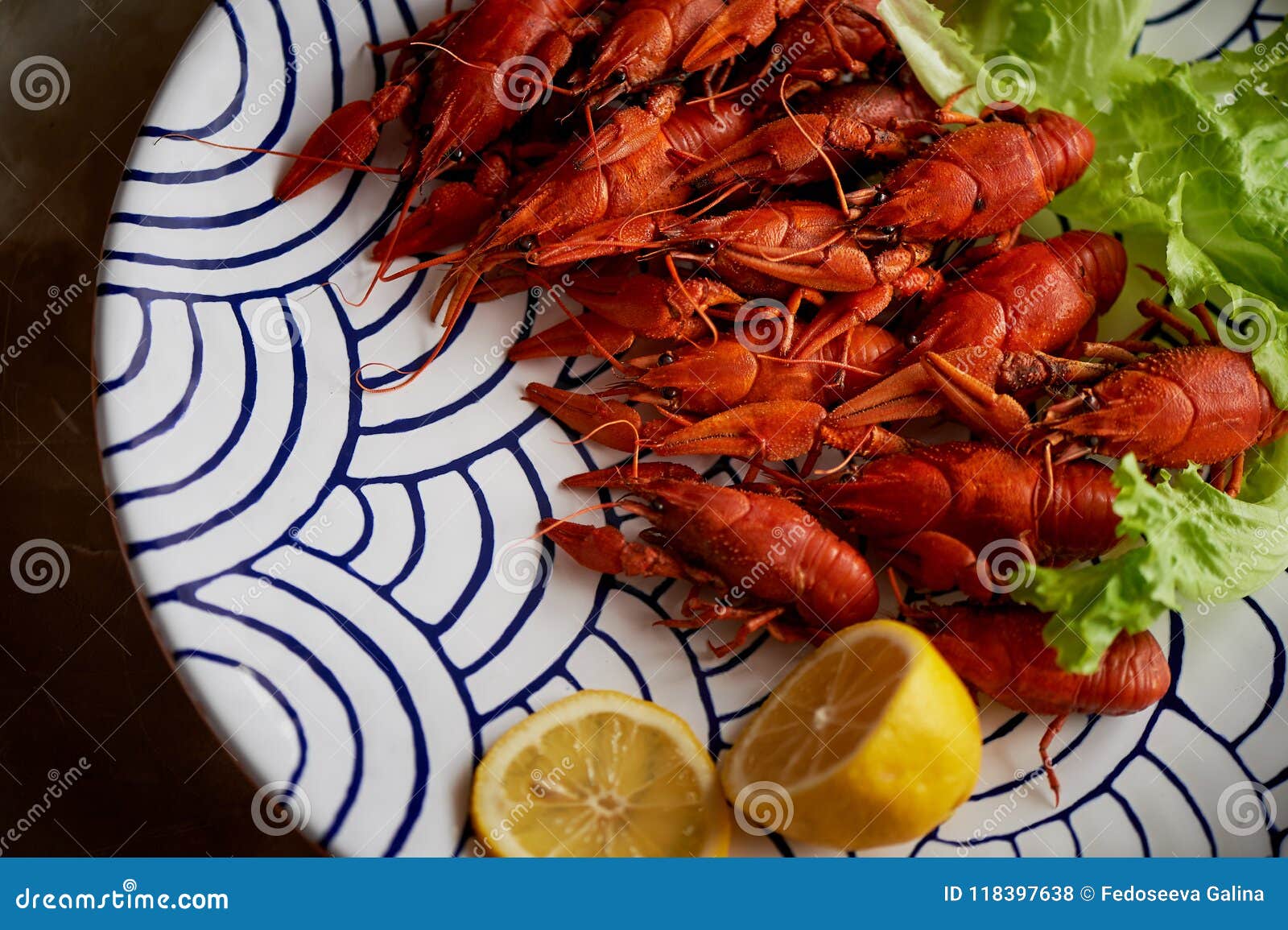 Boiled Crawfish are on the Dish with Interesting Ornament. Fresh Salad ...