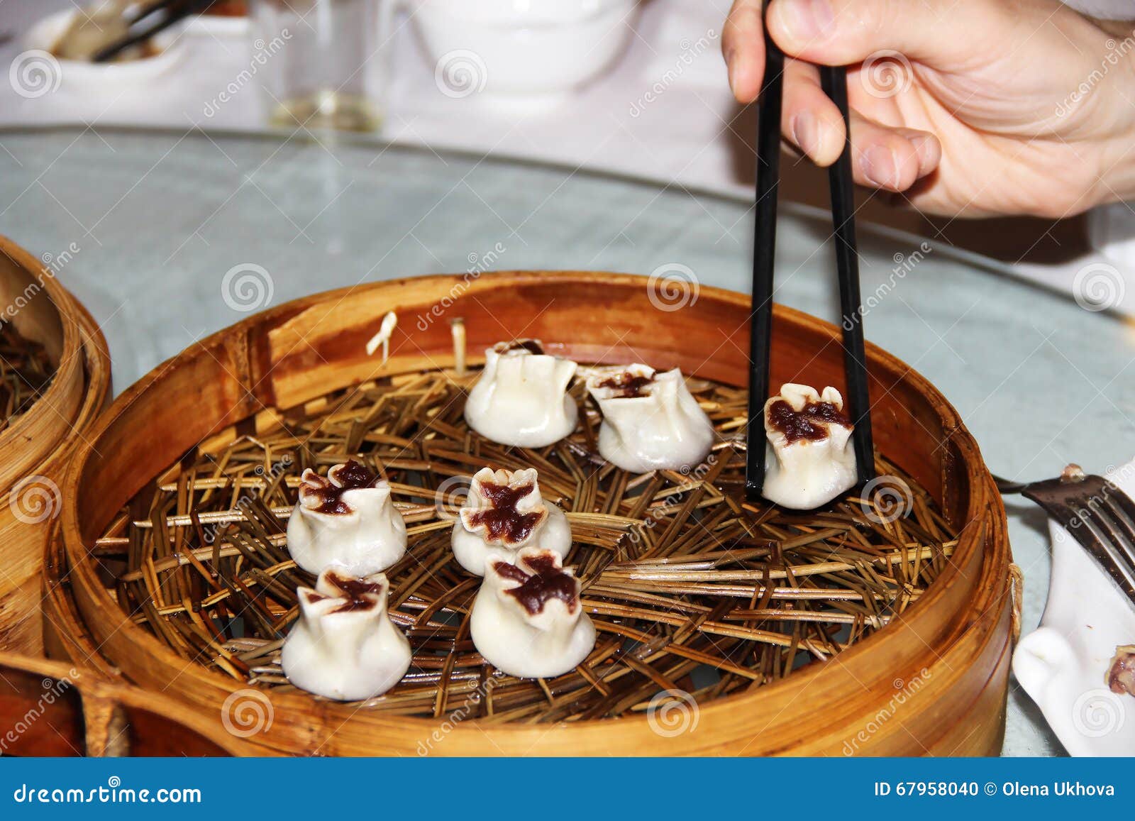 Boiled Dumplings in a Wicker Plate on Dining Table. Chinese Stock Photo ...