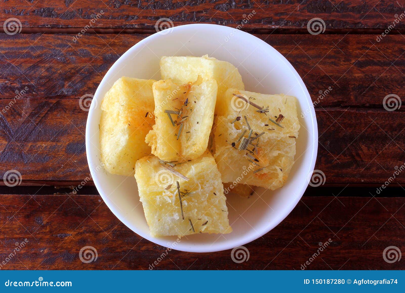 Boiled and Fried Cassava Mandioca in Ceramic Bowl on Rustic Wooden ...