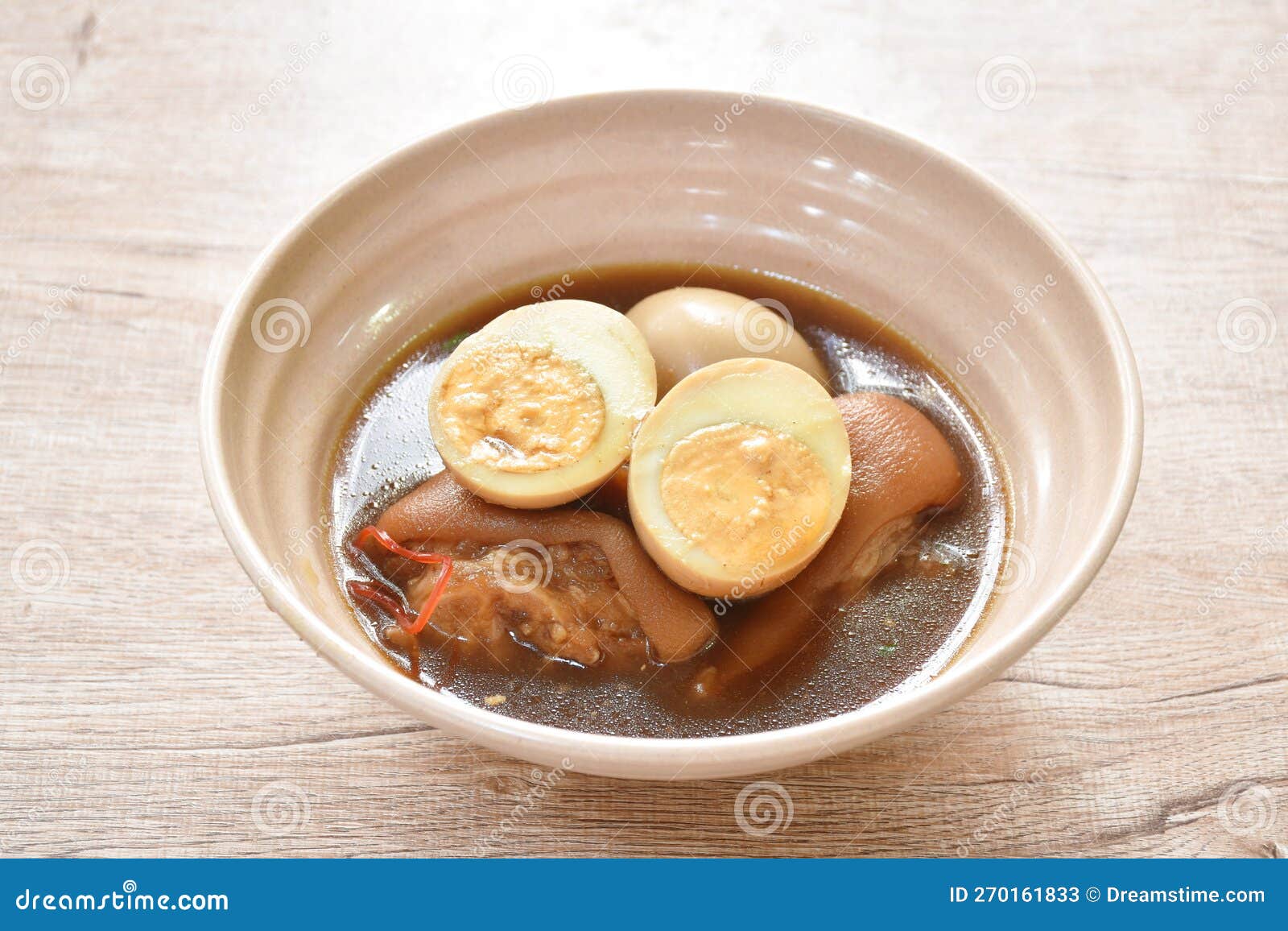 Boiled Half Cut Egg with Fat Pork Leg in Herb Brown Soup on Bowl Stock ...