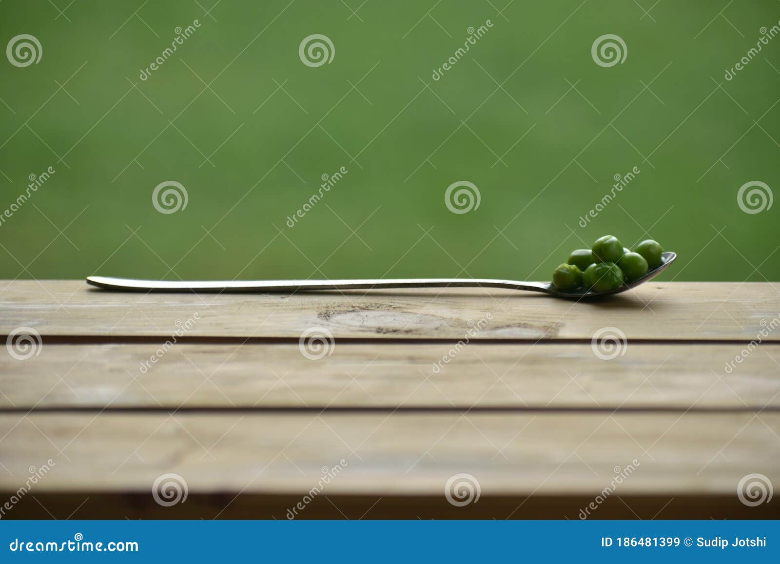 Boiled peas in a spoon stock image. Image of detail - 186481399