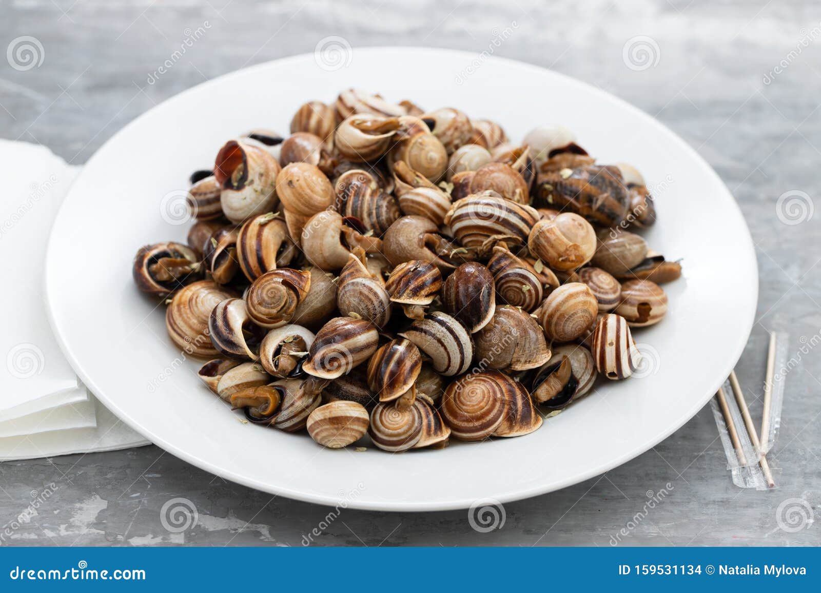 Boiled Snails on White Plate on Ceramic Background Stock Photo - Image ...