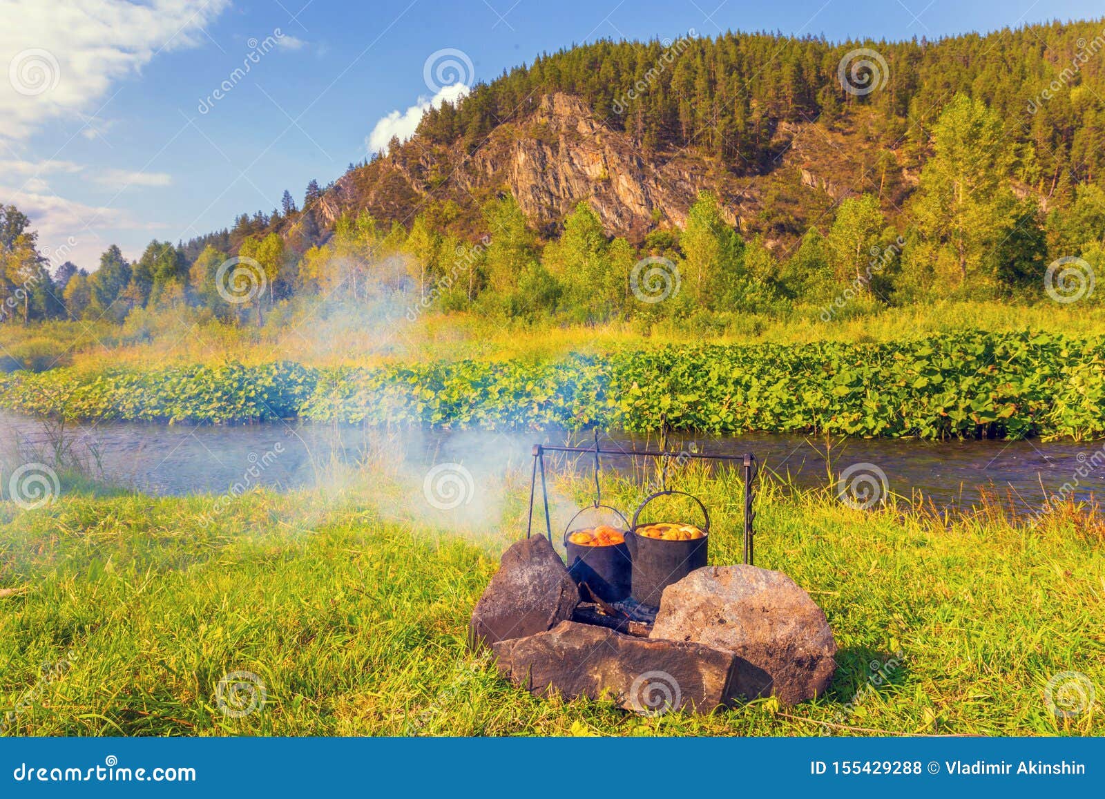 Boilers Hang on a Fire on the River. Stock Photo - Image of colorful ...