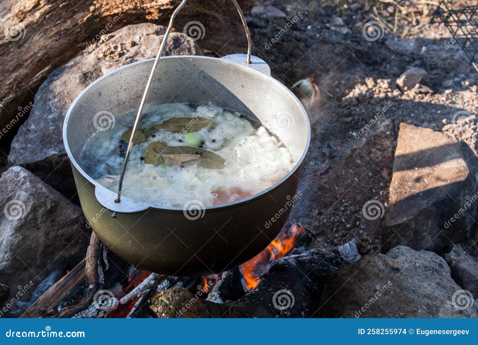 Boiling Cauldron Hangs Over an Open Fire Stock Photo - Image of ...