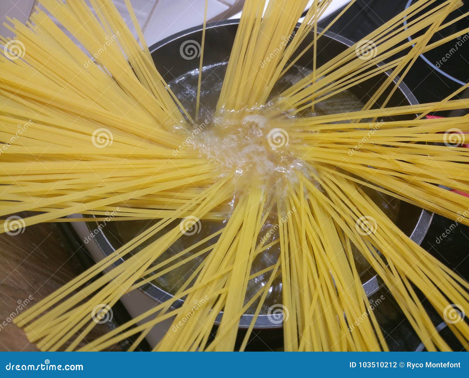 Raw Spaghetti Sticks in a Small Pot Stock Photo - Image of water ...