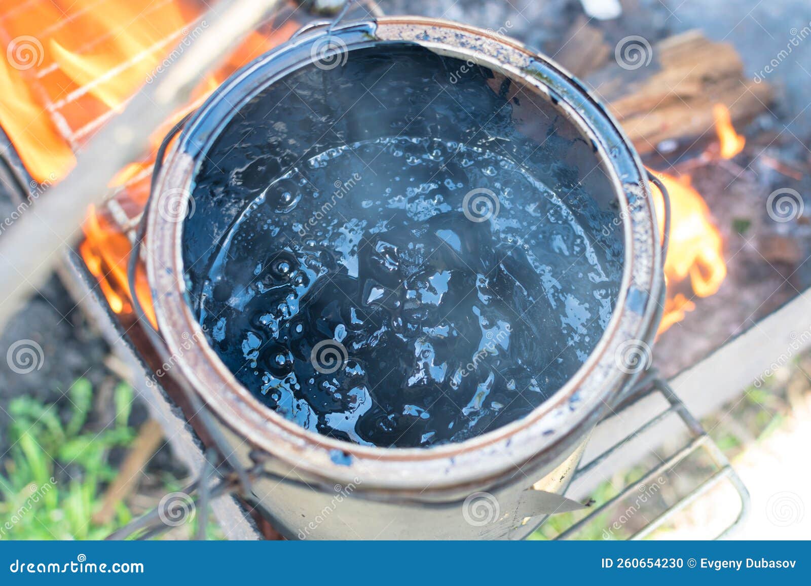 Boiling of Melted Black Tar on Fire with Bubbles and Steam Stock Photo ...