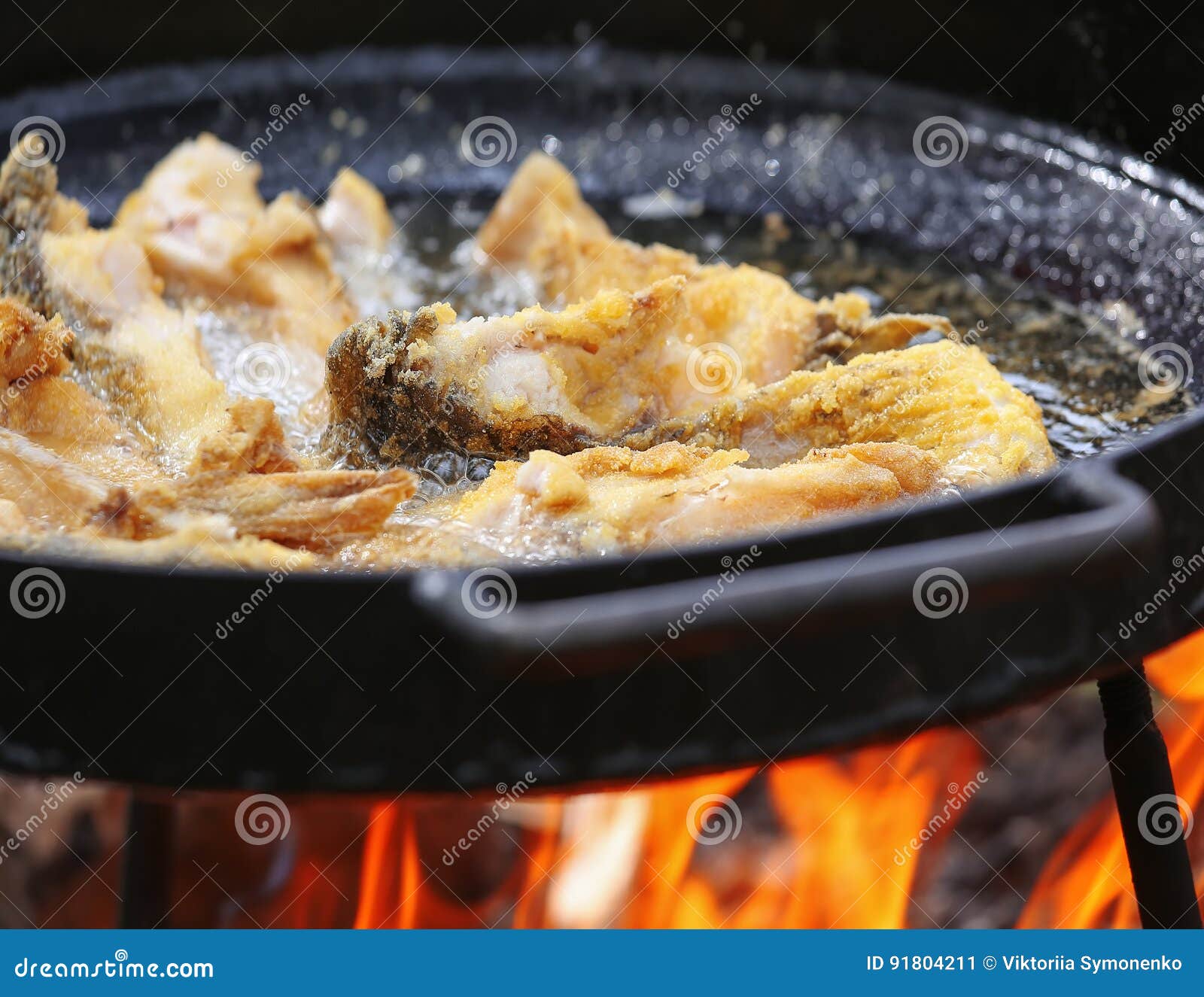 Boiling in Oil on Opened Fire, Frying Fish Fillet. Stock Image - Image ...