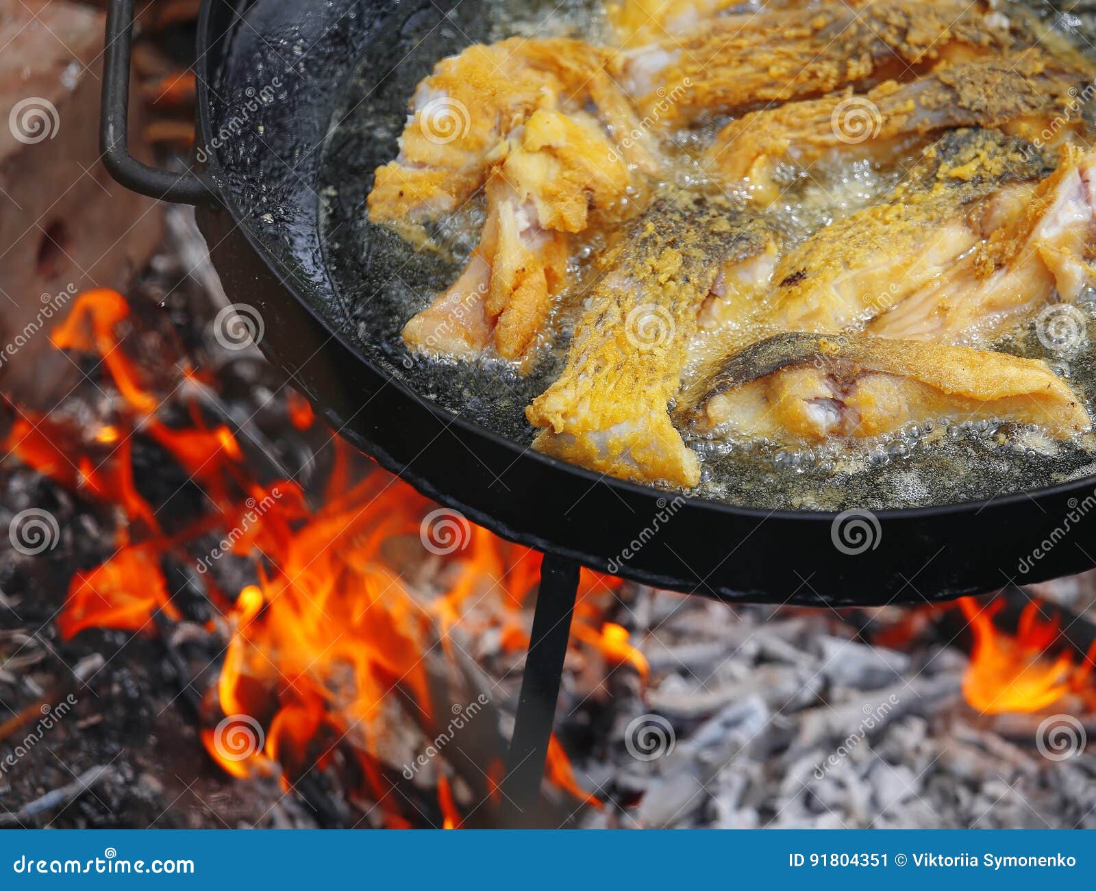 Boiling in Oil on Opened Fire, Frying Fish Fillet. Stock Image - Image ...