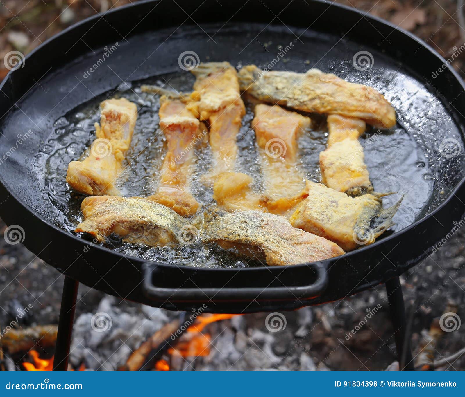 Boiling in Oil on Opened Fire, Frying Fish Fillet. Stock Photo - Image ...