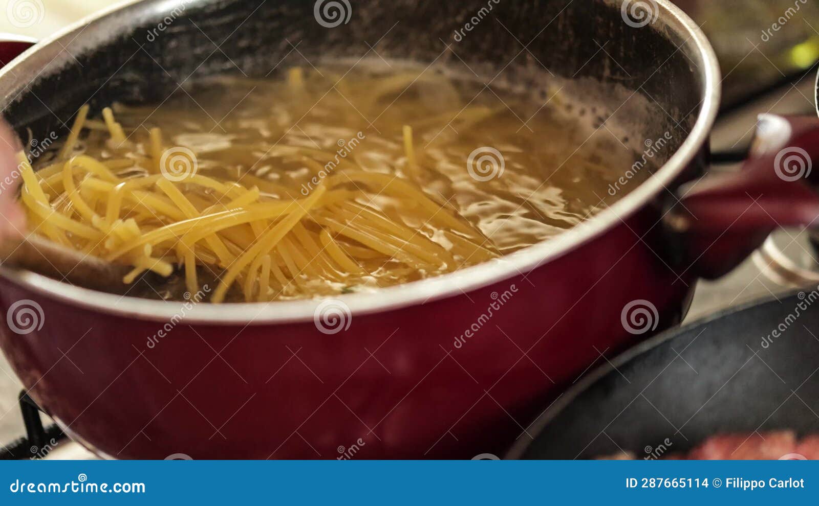 Boiling pasta at home stock footage. Video of gourmet - 287665114