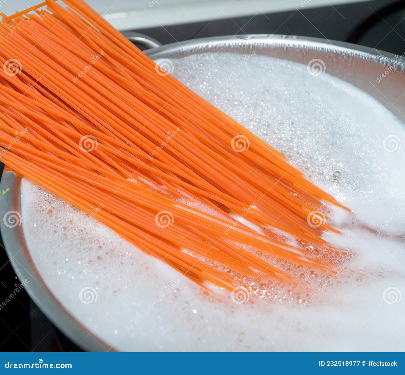 Boiling red past in water stock image. Image of glass - 232518977