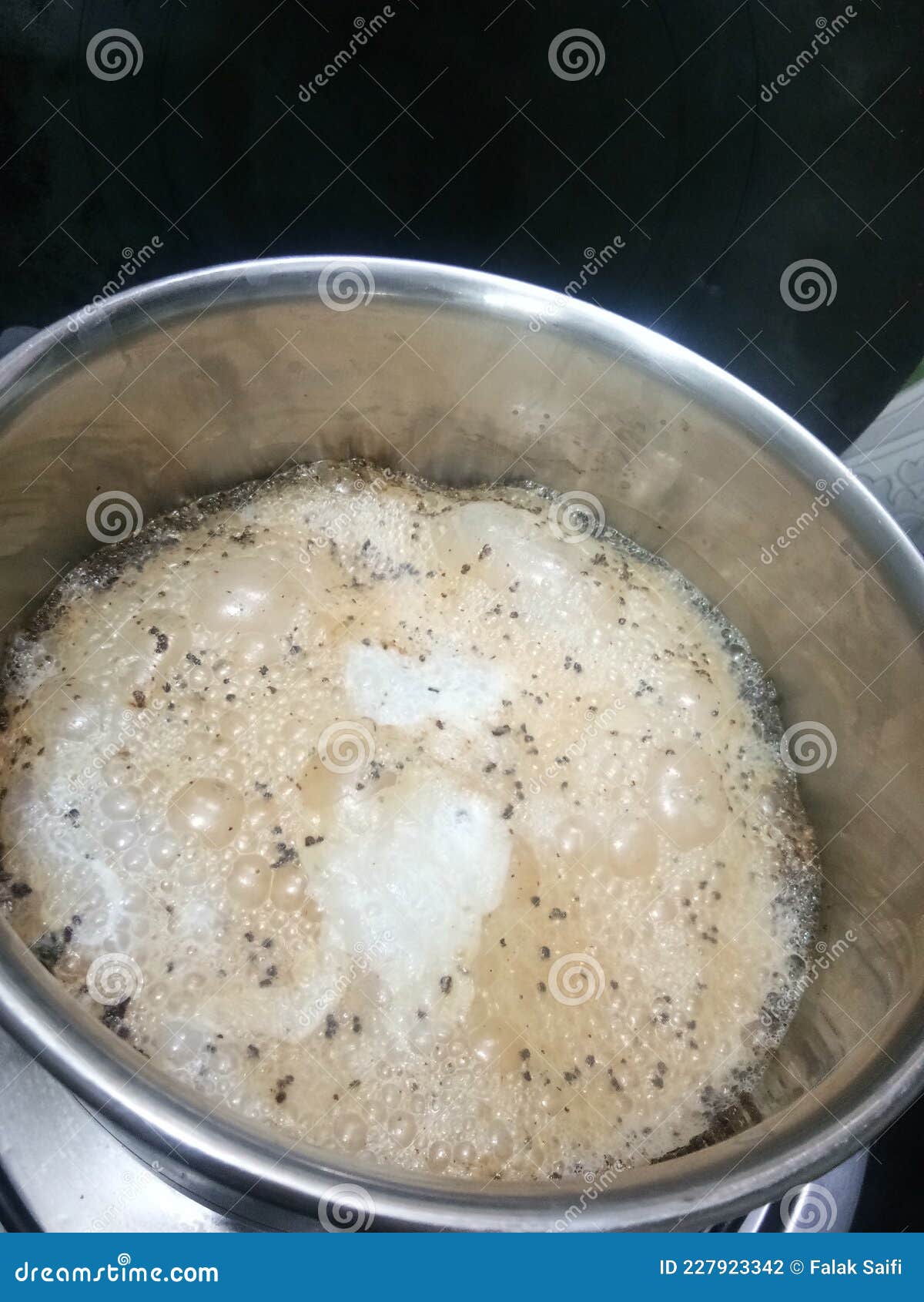 Boiling milk tea in a pan stock photo. Image of meat - 227923342
