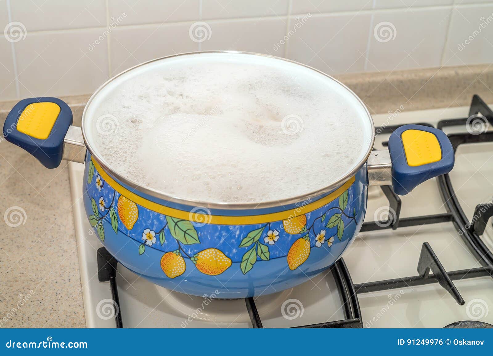 Boiling water in pan stock photo. Image of liquid, orange - 91249976