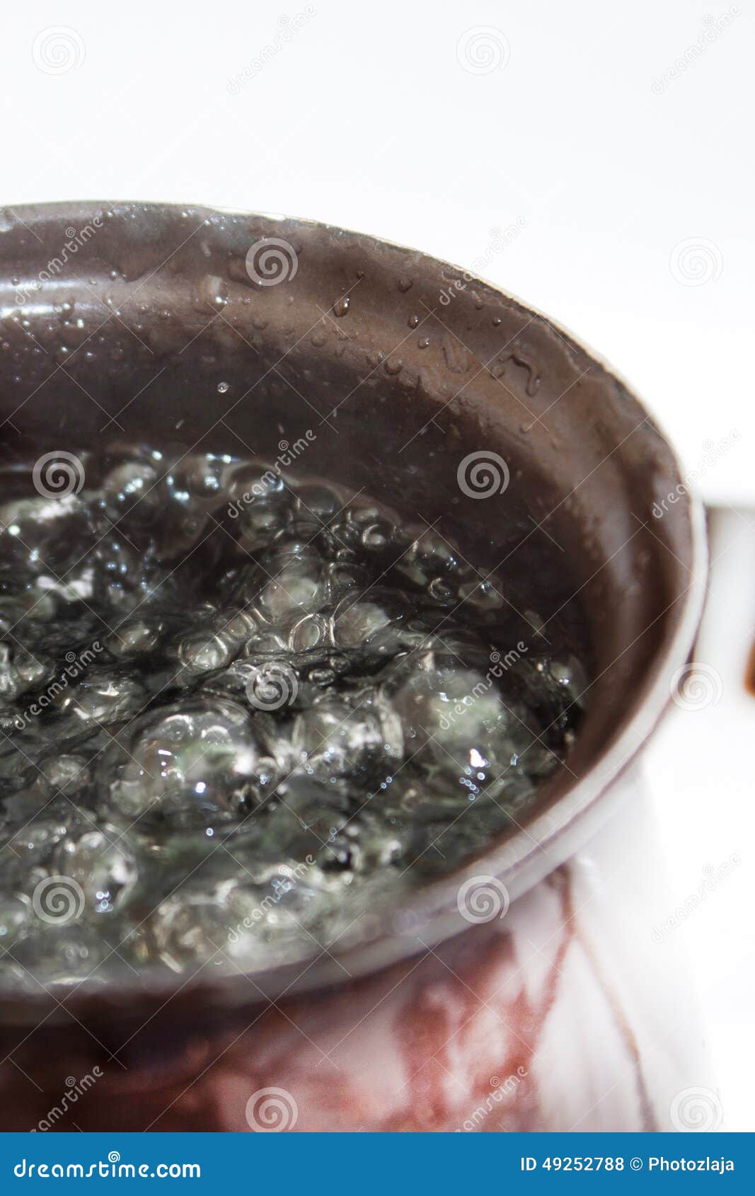 Boiling water in the pot stock photo. Image of ripple - 49252788