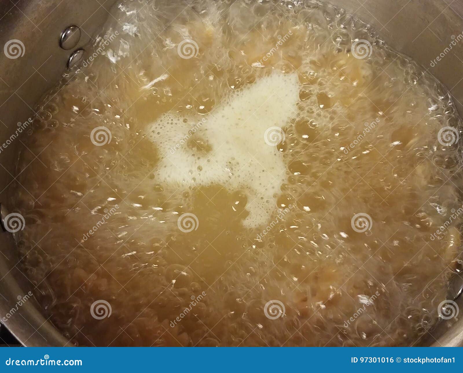 Boiling water in a pot stock photo. Image of turbulent - 97301016