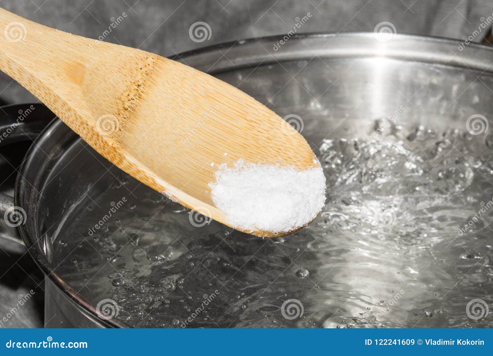 In Boiling Water Pour Salt with a Wooden Spoon. Stock Image - Image of ...