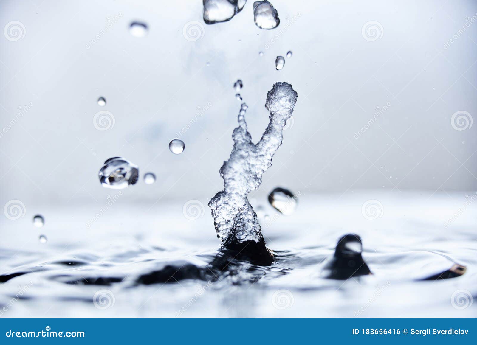 Boiling Water Splash with Steam on Blue Background Closeup Stock Photo ...