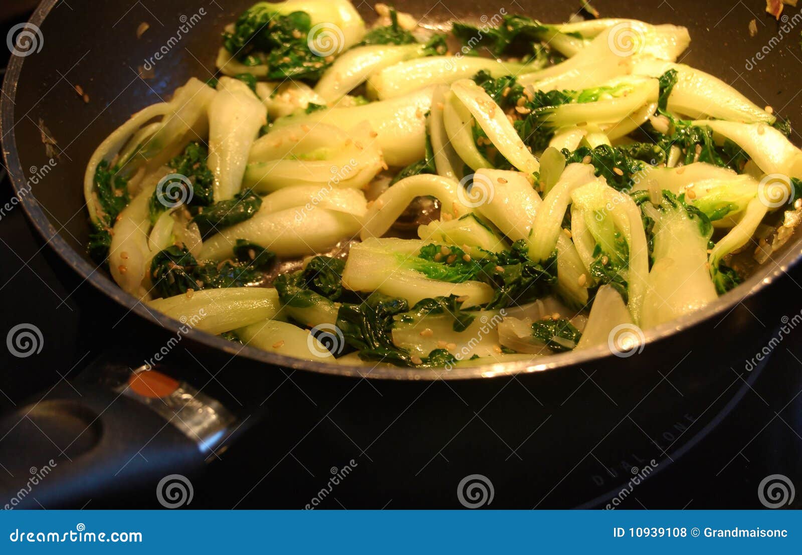 Bok Choy cooking in pan stock photo. Image of utensil - 10939108