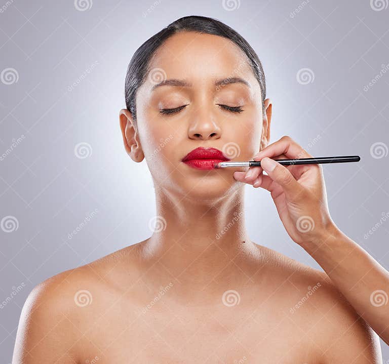A Bold Red Lip Is My Go To An Attractive Young Woman Standing In The