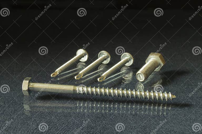 Bolt with Thread by Nut and Puck on Table with Reflection Stock Image ...