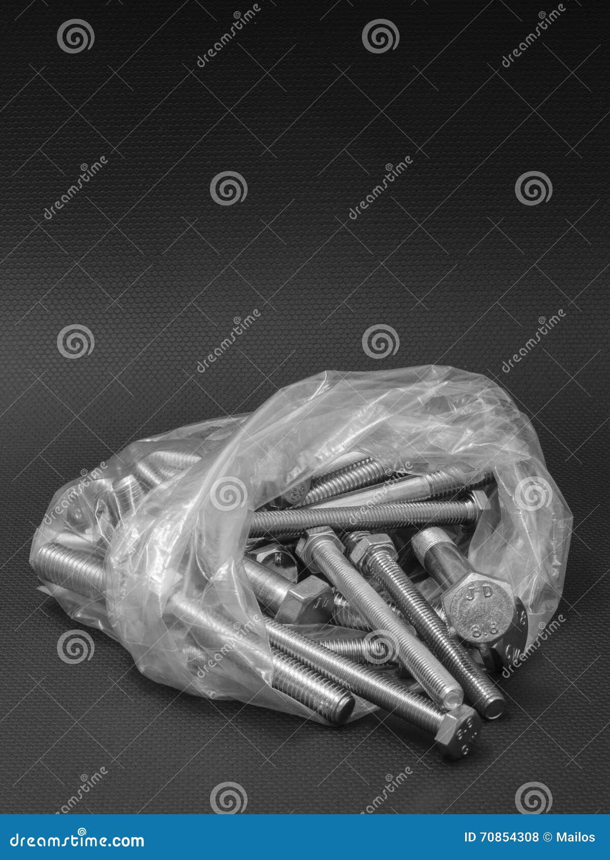 Bolts in a Clear Plastic Bag on a Black Background Stock Photo - Image ...