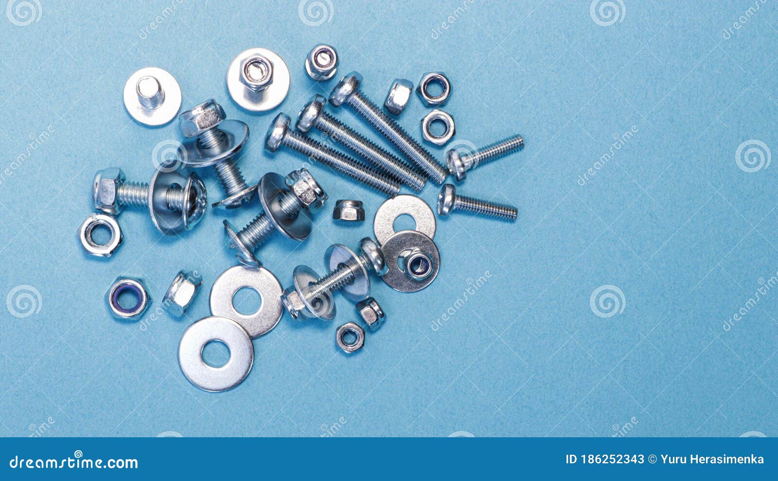 Bolts, Nuts and Washers of Different Sizes on a Blue Background Stock ...