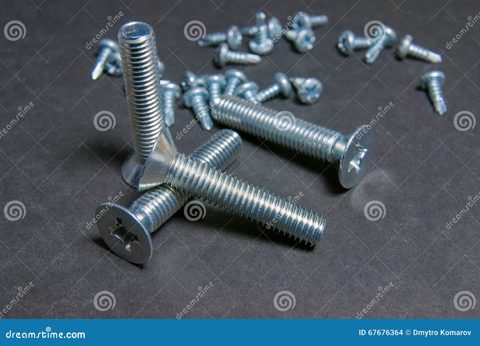 Bolts and Screws on Grey. Left Upright Bolt Stock Photo - Image of ...